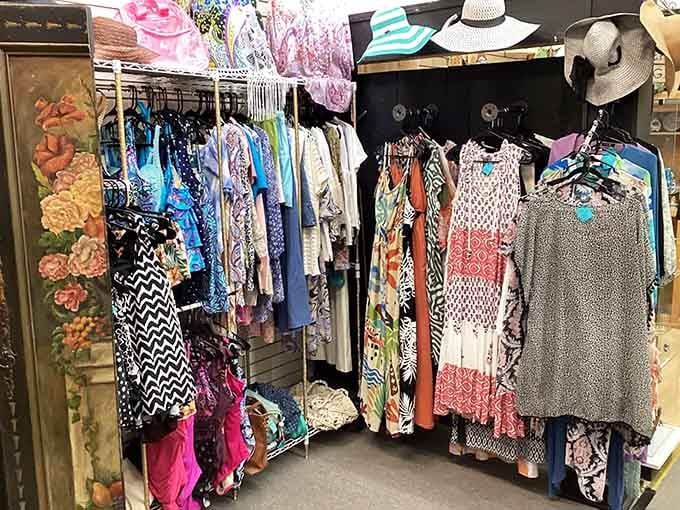 Colorful dresses and sun hats packed together, a whole wardrobe of stories waiting for new chapters.