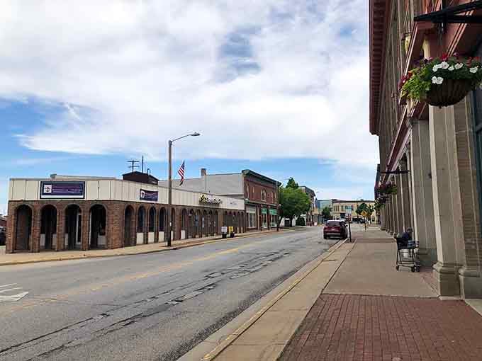 Hanging flower baskets brighten Marinette's main street, proving that even a budget-friendly town knows how to dress up for company.