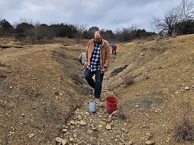 Buckets, boots, and boundless curiosity. This gentleman is doing retirement exactly right, one fossil at a time.
