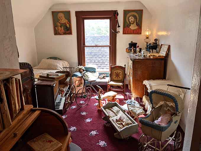 Antique prams and childhood relics packed into one small room, proof that nostalgia has always been a full-time occupation.