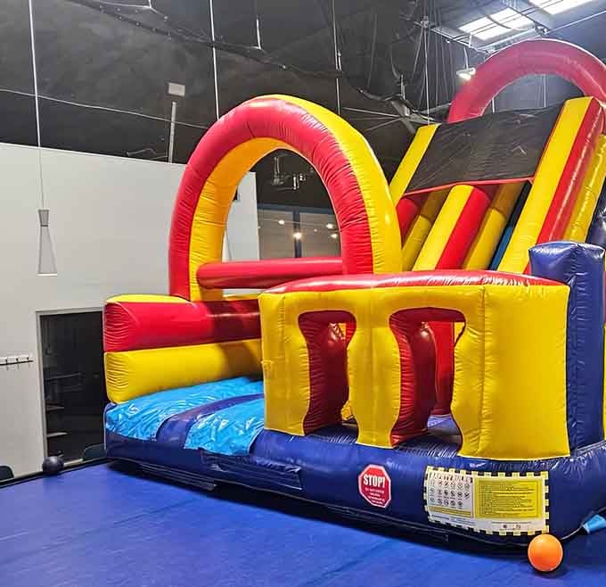 Inflatable obstacle courses in primary colors that scream "fun" louder than kids at a birthday party sugar rush peak.