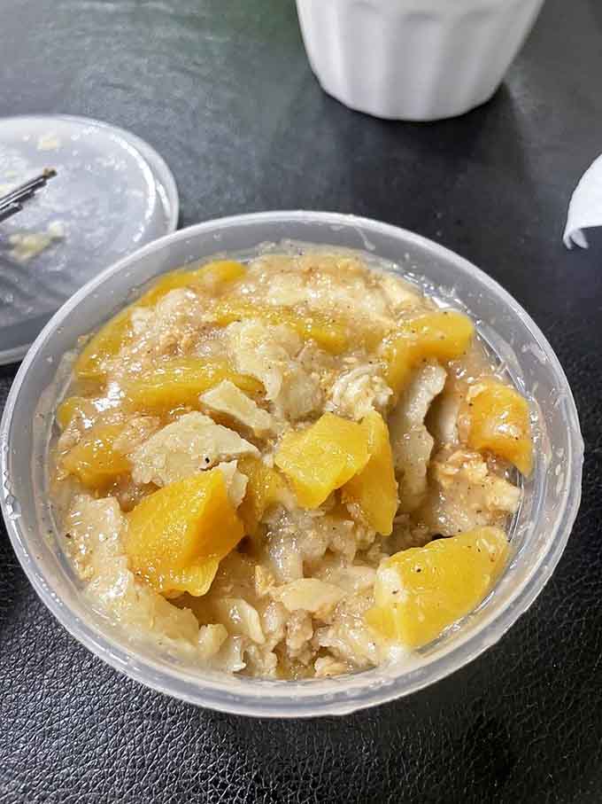 Peach cobbler with big, soft peach chunks and a tender crust, the kind of dessert that makes you reconsider your life choices.