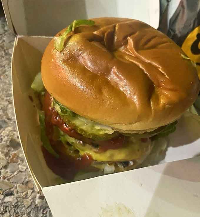 A half-pound Angus beef burger on a buttered brioche bun, proof that Nathan's has always been about more than just frankfurters.