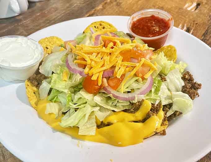 This taco salad piled high with fresh toppings and cheese shows that "gas station food" has officially lost all meaning here.