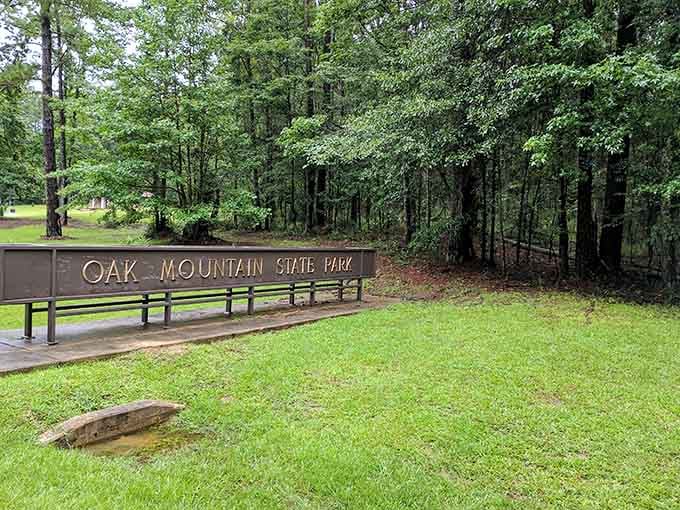 The sign says Oak Mountain State Park, but your heart reads it as "exactly where you need to be."