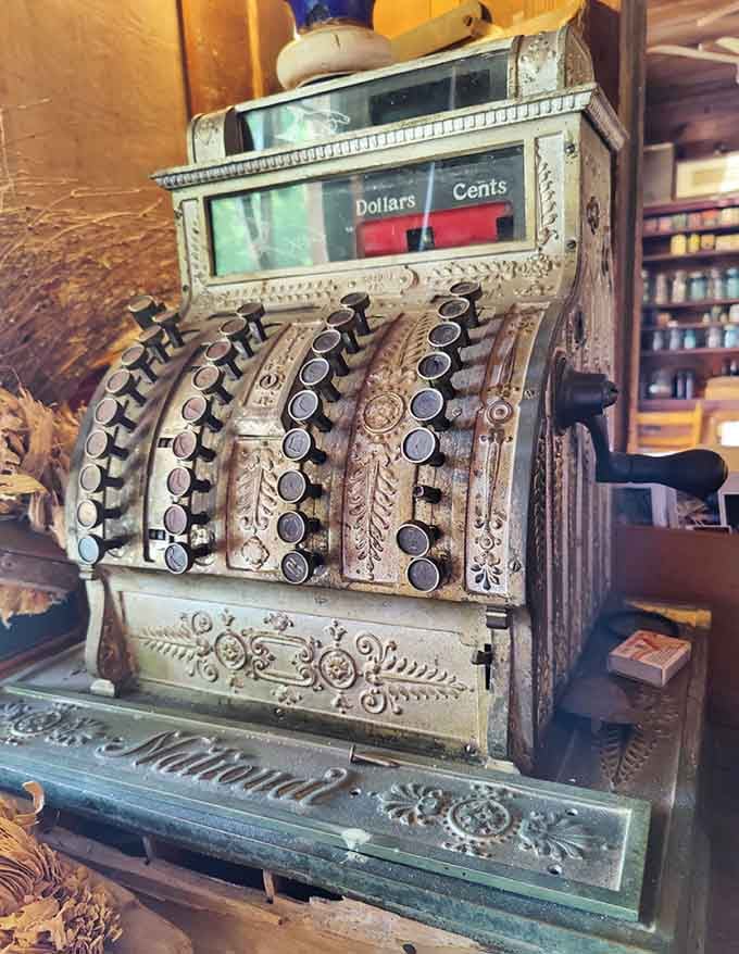 This ornate National cash register has seen more transactions than your bank app, and it looks far better doing it.