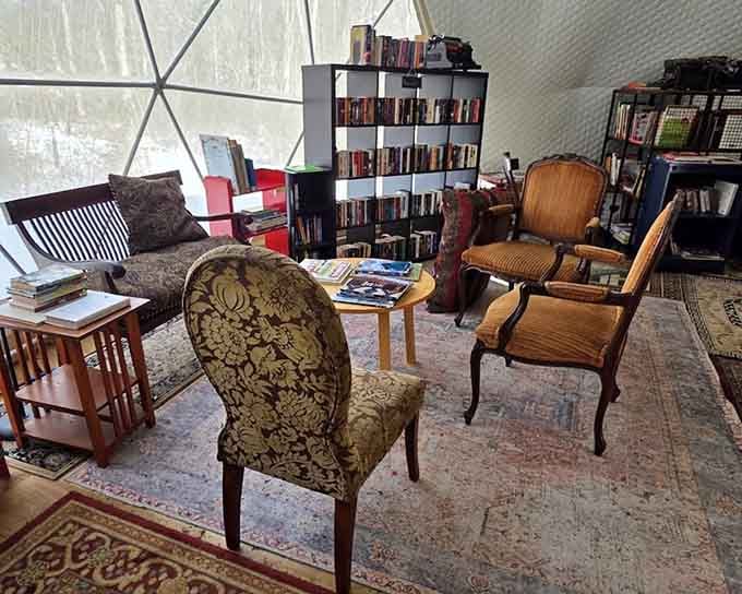 Elegant chairs arranged around a small table inside a dome, like a book club meeting that somehow got wonderfully out of hand.