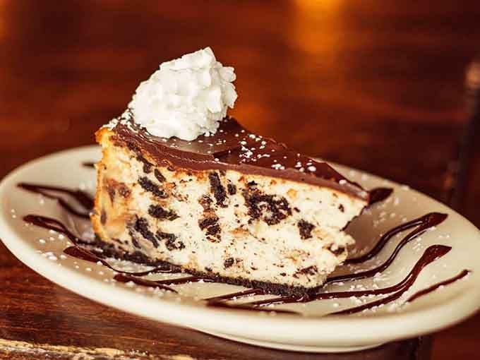 Chocolate ganache, cookie crumbles, and whipped cream on cheesecake, dessert at Parma Tavern is not playing around.