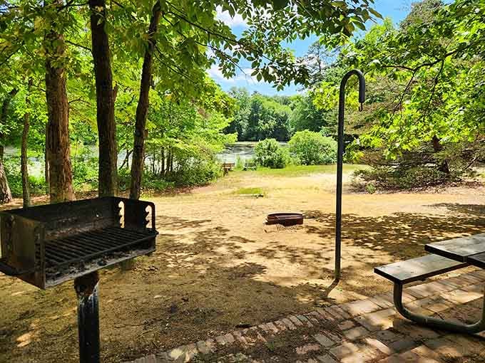 A charcoal grill, a picnic table, and a lake view. Somebody figured out the perfect lunch spot long ago.