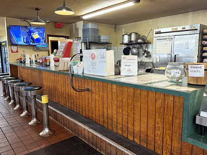 Classic counter stools, wood paneling, and a kitchen humming behind the counter, this is old Florida at its finest.