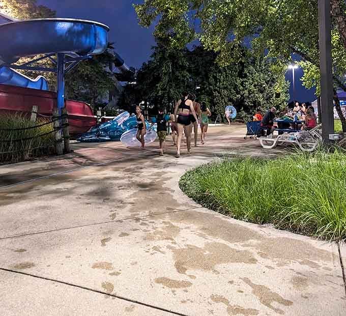 Even after dark, Pelican Harbor keeps the energy going. Wet footprints tell the whole story.