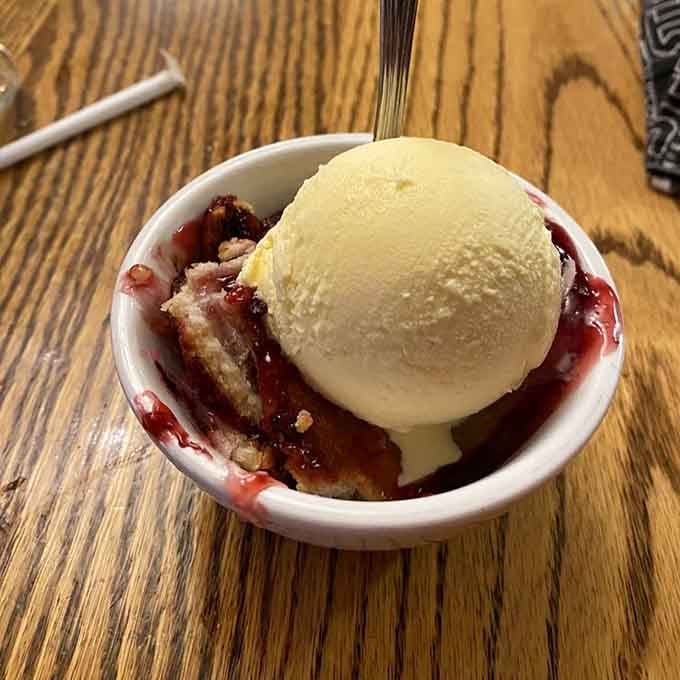 Warm fruit cobbler crowned with a perfect scoop of vanilla ice cream, this little bowl is basically a standing ovation in dessert form.