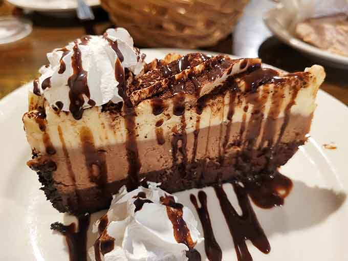 That chocolate cheesecake drizzled with fudge sauce is the dessert equivalent of a standing ovation. Save room, always.