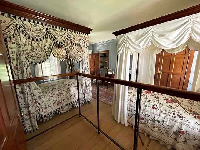 Two canopy beds, one room, and enough floral fabric to make even the most skeptical visitor stop and stare.