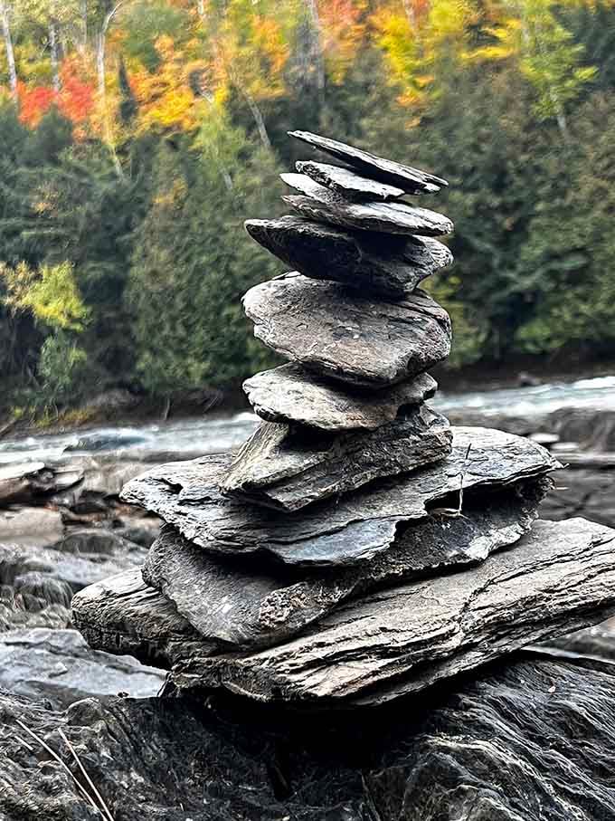 Someone stacked these flat river stones into a perfect tower, which is either art, meditation, or showing off. Possibly all three.
