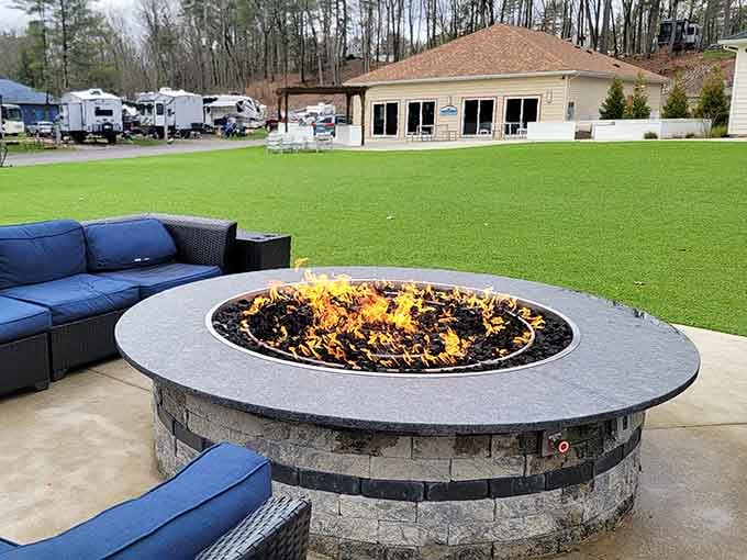 A stone fire pit with blue cushioned seating, the evening's entertainment sorted before sunset.