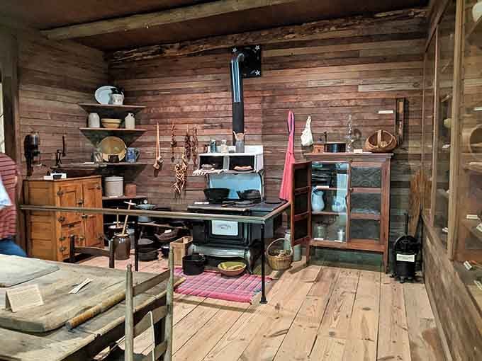 This pioneer kitchen's wood stove and simple furnishings make your complaints about cooking seem rather trivial.