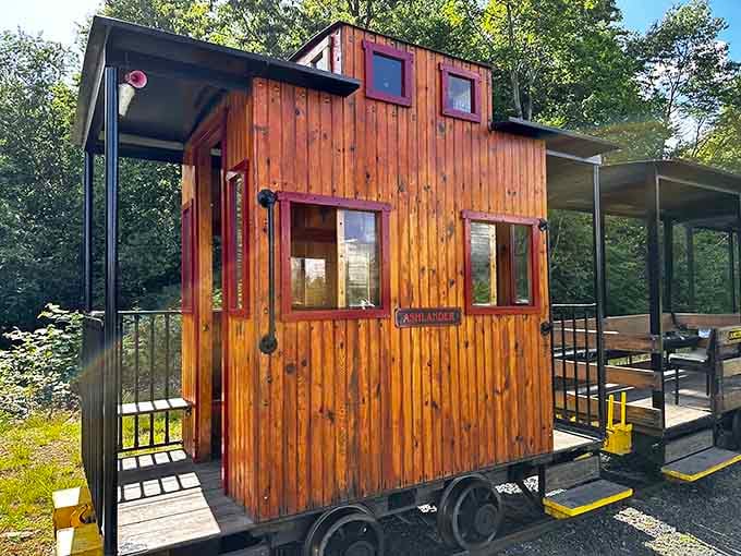 The charming wooden caboose named "Ashlander" is proof that even train cars deserve a proper hometown name.