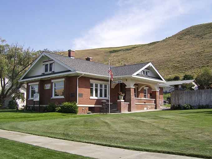 Pomeroy's tidy brick library sits beneath a rolling hillside, the kind of neighborhood gem that makes you want to grab a book and never leave.