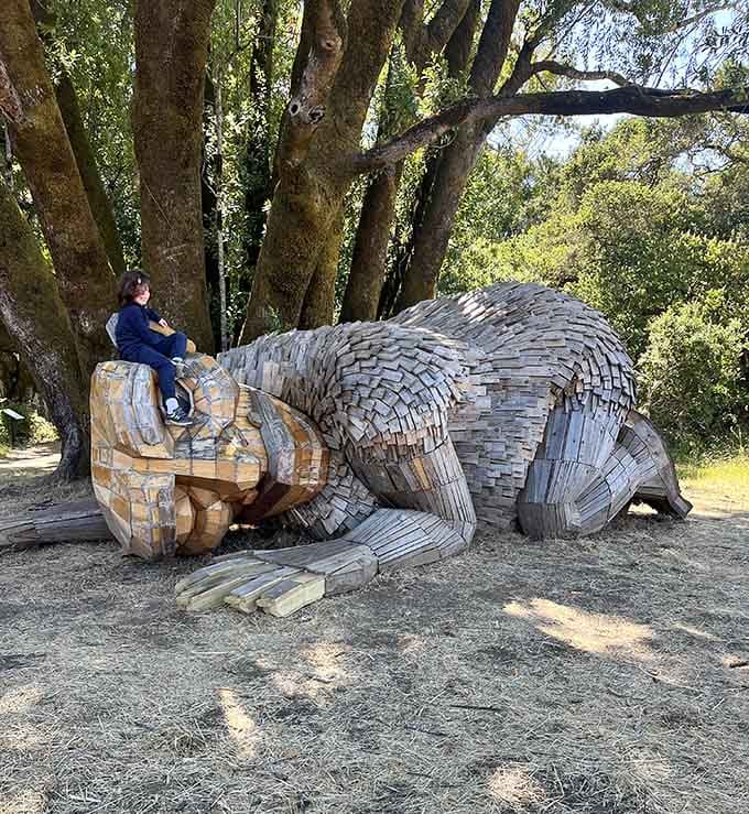 A giant wooden troll napping under the trees, because Golden Gate Park apparently decided flowers alone weren't surprising enough.