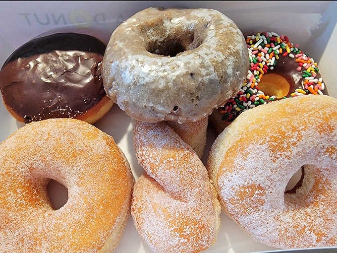 Half a dozen donuts arranged like a delicious puzzle where every piece is the right answer to your morning cravings.