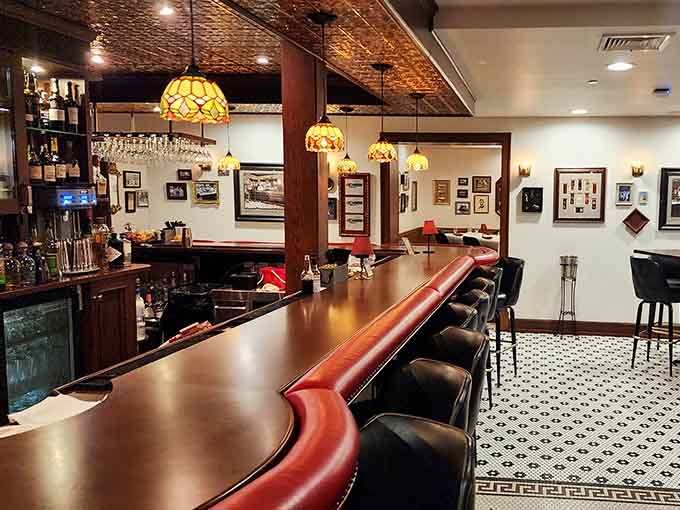 A bar this handsome, with Tiffany pendant lights overhead, deserves a slow, appreciative nod before you sit down.