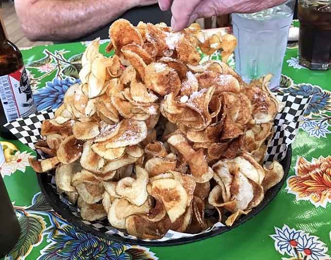 House-made chips piled sky-high in a bowl, crispy, golden, and completely impossible to stop eating after just one.