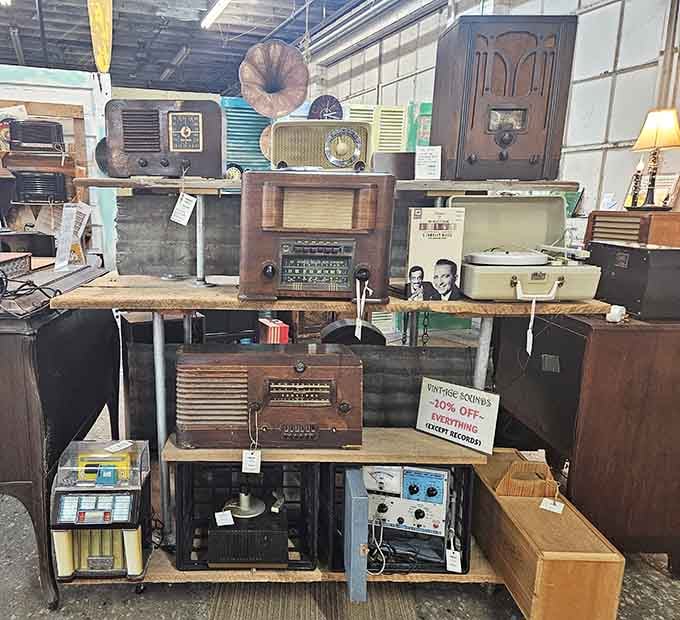 A wall of vintage radios stacked high, each one a reminder that great sound never really goes out of style.