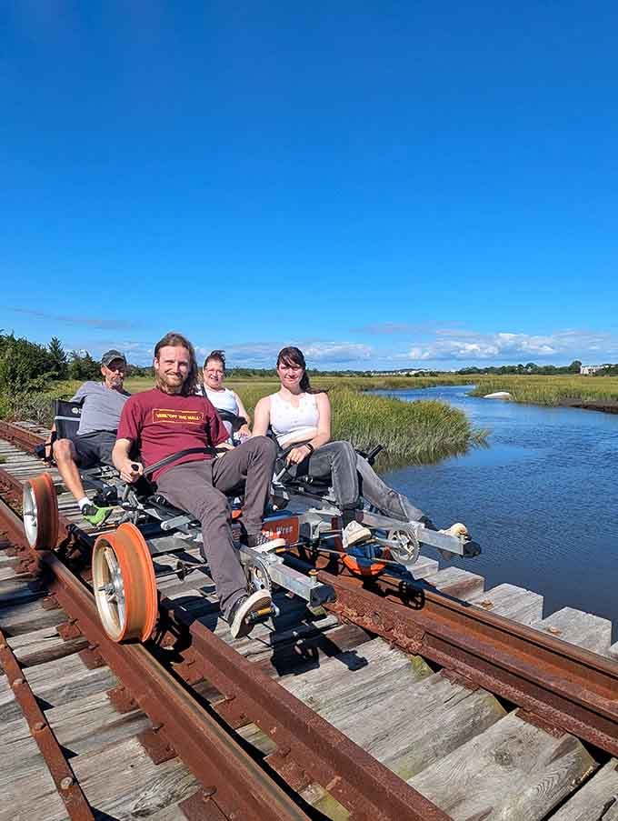 Crossing the marsh on a rail bike trestle, with nothing but open water and blue sky all around you.