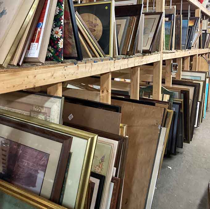 Framed artwork leans in organized rows, waiting to transform your blank walls into gallery spaces.