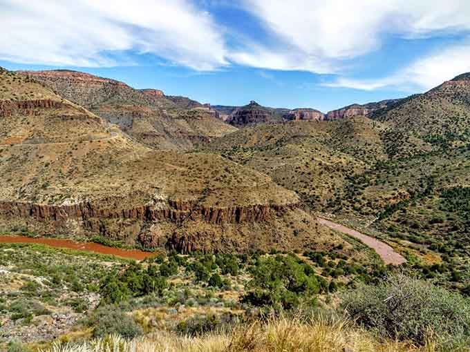 The river winds below like a painter's brushstroke, adding that perfect touch of color to nature's monumental canvas.