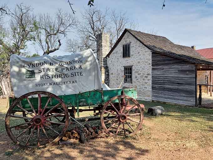 A covered wagon parked outside the Lyndon B. Johnson State Park, carrying stories heavier than any cargo.