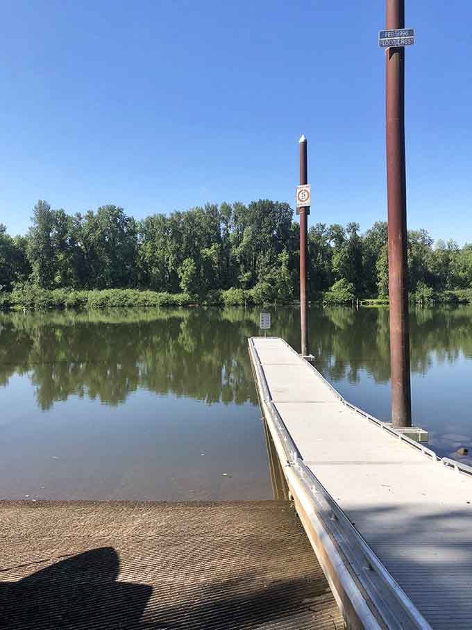 A quiet boat ramp reaches into still green water, the kind of launch point that starts genuinely good days.