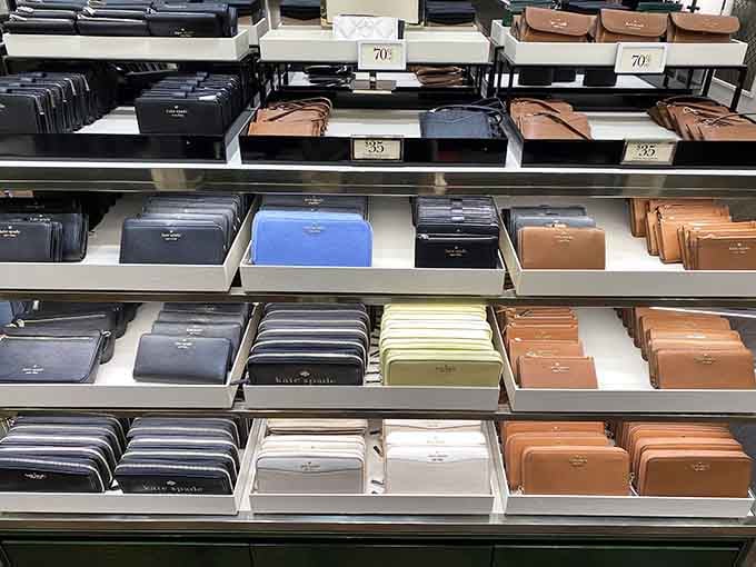 Rows of Kate Spade wallets in every color imaginable. Organized, beautiful, and dangerously tempting all at once.