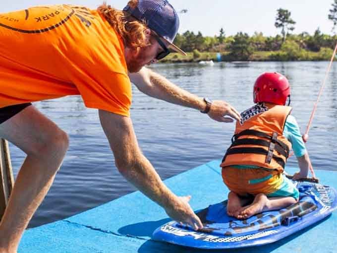 Helping hands guide little ones across the bouncy platforms, creating memories one wobbly step at a time.
