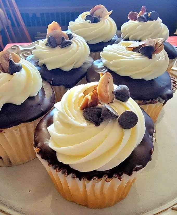 White frosting, chocolate dip, almond slivers, and chocolate chips. This cupcake is dressed for a very good occasion.