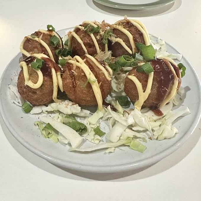 Golden, crispy Takoyaki drizzled with okonomiyaki sauce and kewpie mayo, because starters should never be an afterthought.