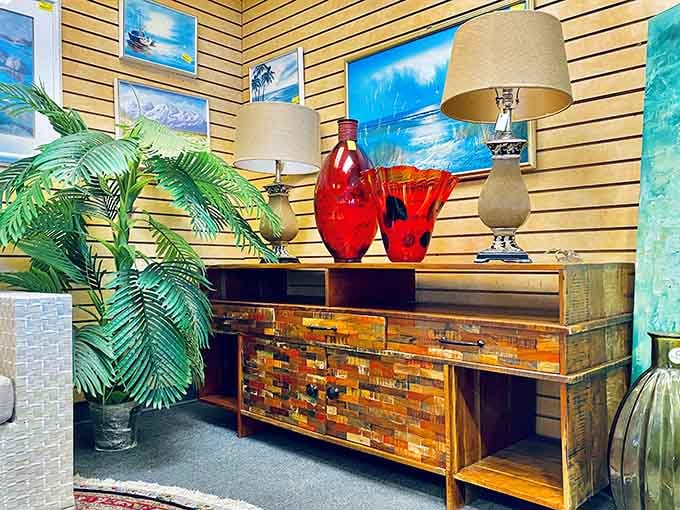 Mid-century credenza meets bold red glass vases in a display that screams "Mad Men" meets modern Florida.