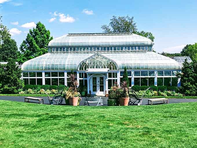 The Corbin Conservatory sits on the grounds like a Victorian dream that somehow became very real in Akron, Ohio.