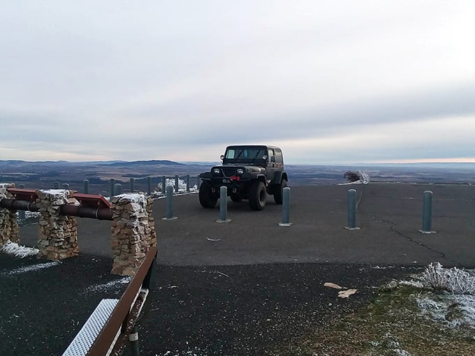 The summit parking area proves that sometimes the best destinations don't need valet service or gift shops.