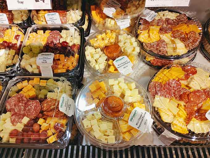 Ready-to-go cheese and charcuterie trays that make you look like you planned everything. Your guests don't need to know otherwise.