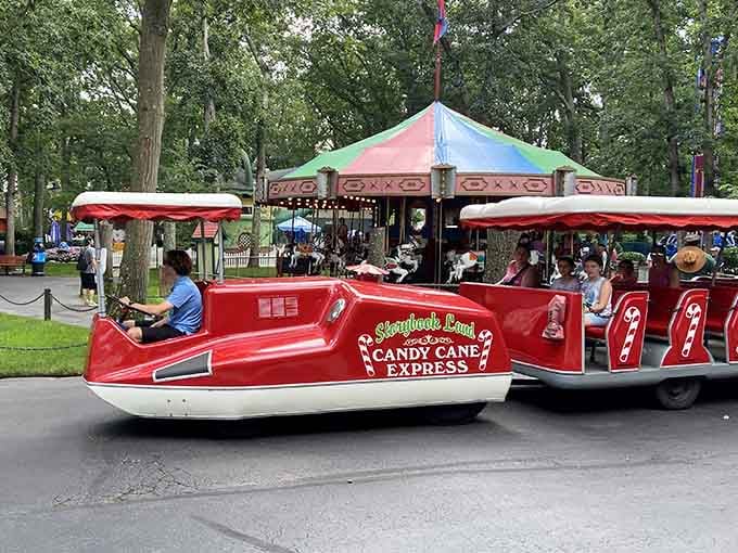 The Candy Cane Express tram rolls past the classic carousel, giving your feet a well-deserved break from all that wonder.