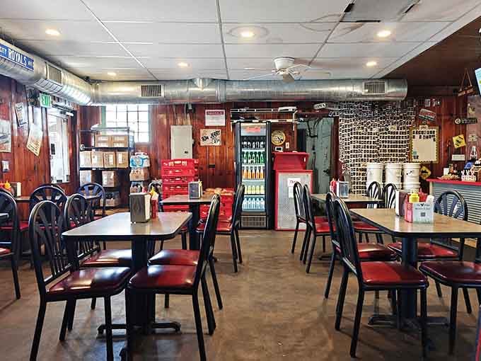 Exposed ductwork, warm wood walls, and a cooler full of bottled sodas. Comfort lives here, rent-free.