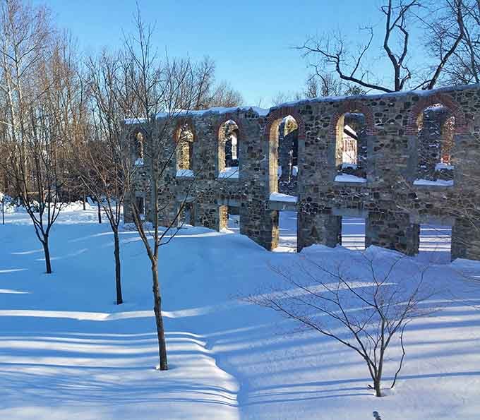 Snow-covered ruins under a brilliant blue sky, because even in winter, this place refuses to be ignored.