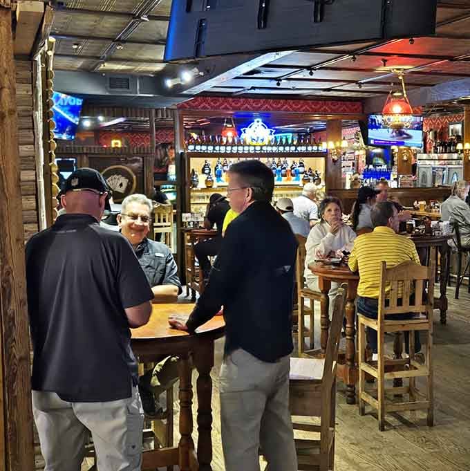 Good food, good company, and a bar glowing behind them. Some nights just write themselves.