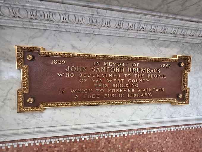 A memorial plaque honoring the vision that turned "free books for everyone" from radical idea to reality.