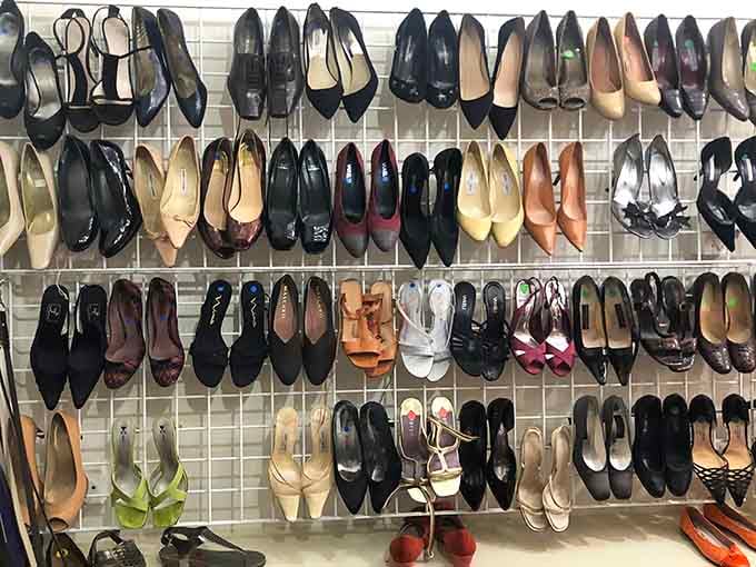 A shoe rack full of elegant heels that have clearly been to places worth dressing up for.