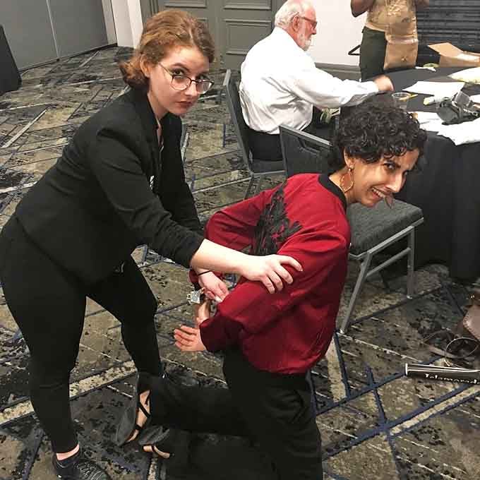 Getting handcuffed at dinner sounds alarming, but here it just means the show is going exactly as planned.