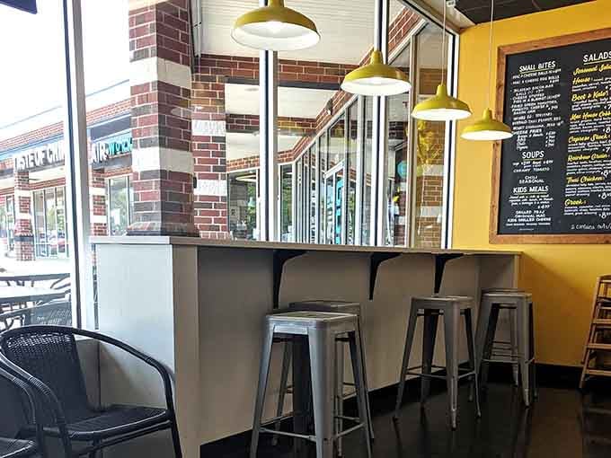 Window-side seating with those pendant lights overhead creates the perfect spot for watching the world while enjoying your cheesy feast.