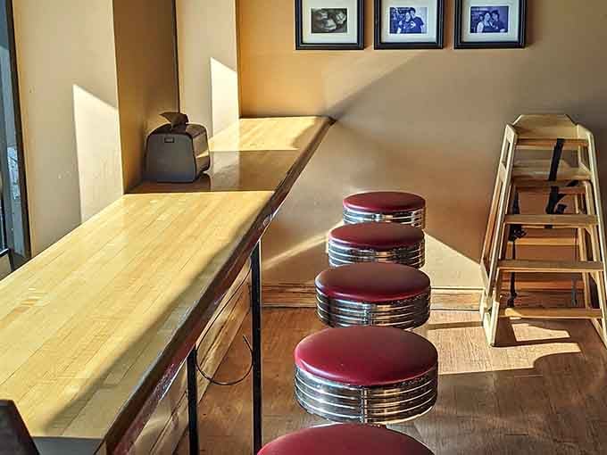 Classic diner stools catching the afternoon light, quietly waiting for the next happy customer to arrive.